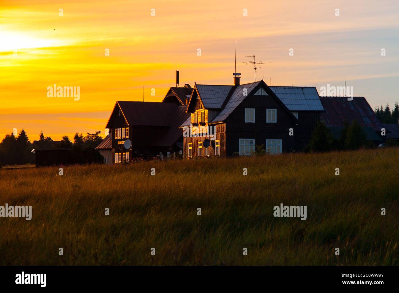 Wooden mountain hut at sunset time, Jizerka village, Jizera Mountains ...