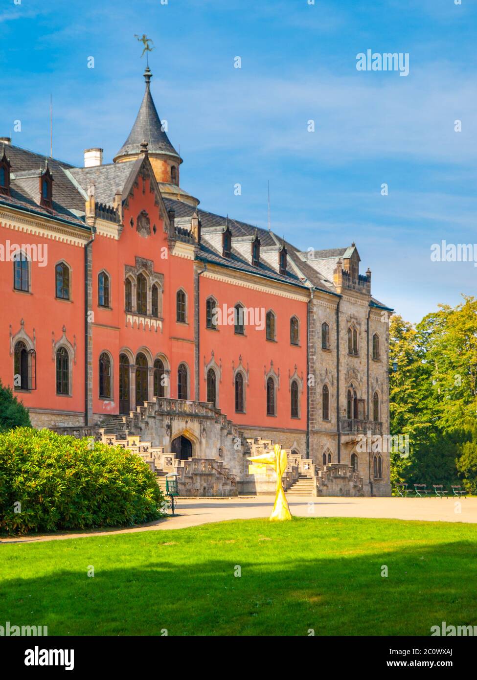 Sychrov Castle with typical pink facade. Neo-Gothic style chateau with ...