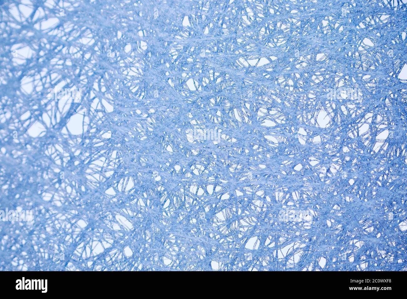A sheet of white paper shot under a microscope on a white background ...