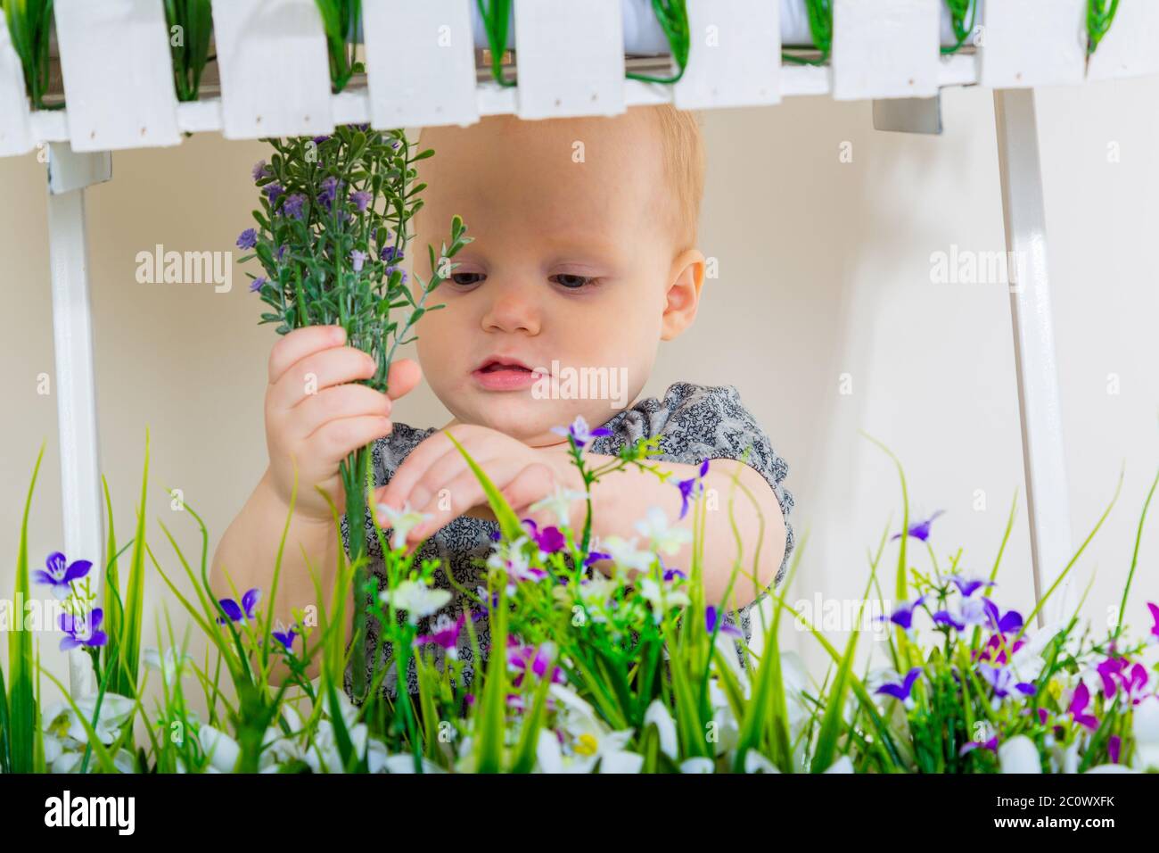 Cute girl with spring flowers Stock Photo - Alamy