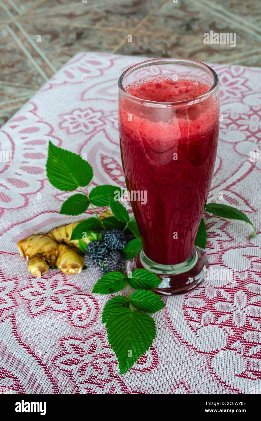 Glass Of Red Juice Of Black Raspberry Fruit Stock Photo - Alamy