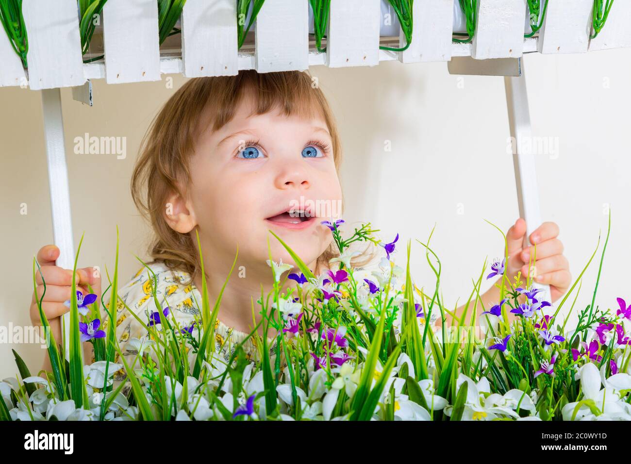 Cute girl with spring flowers Stock Photo - Alamy