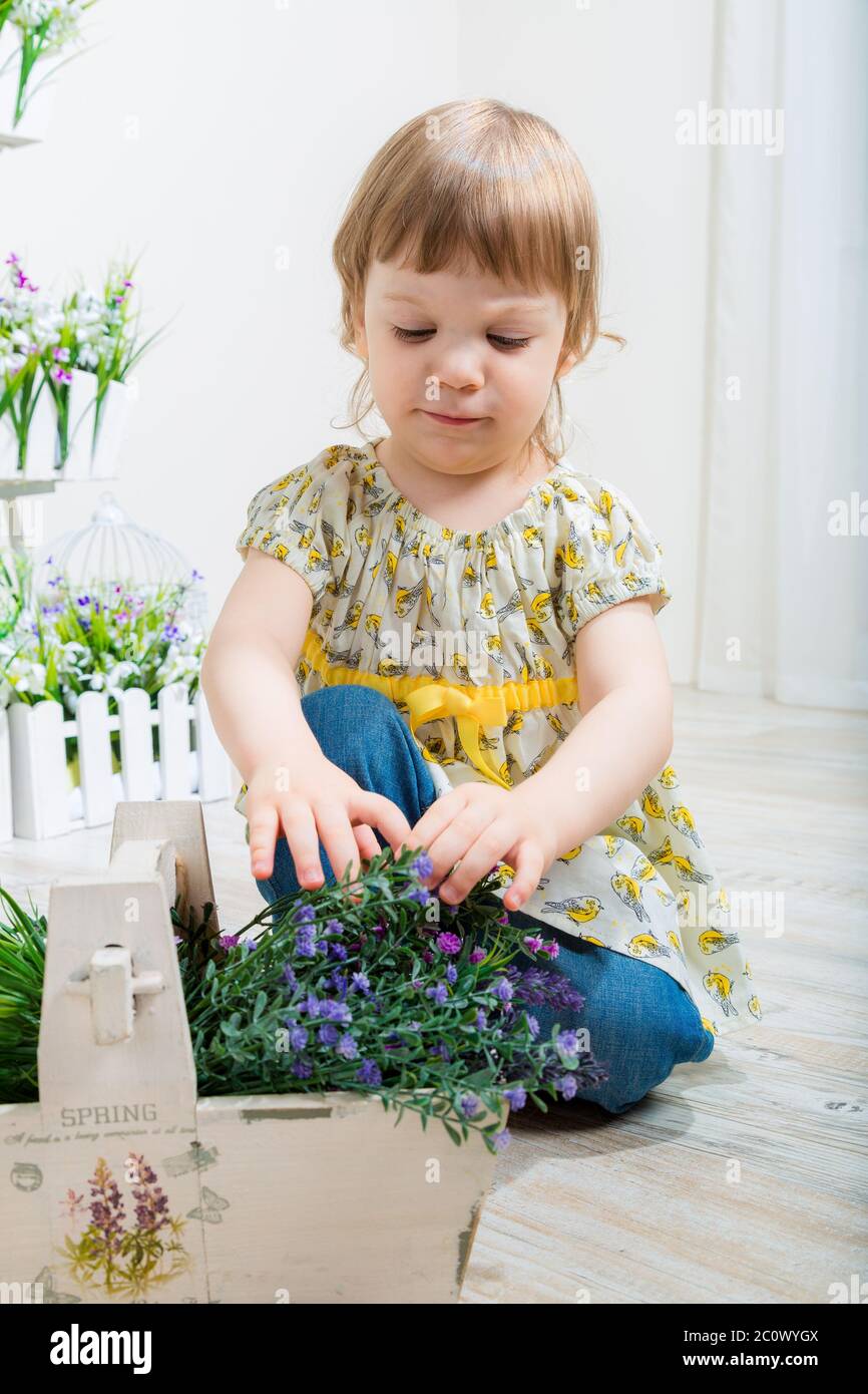 Cute girl with spring flowers Stock Photo - Alamy