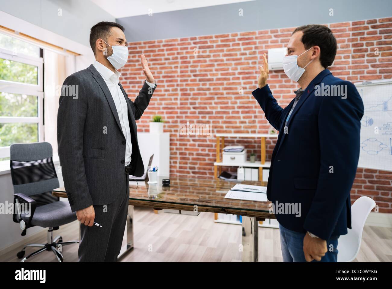 Man Avoiding Handshake To Stop Covid-19 Spread Waving Hands Stock Photo ...