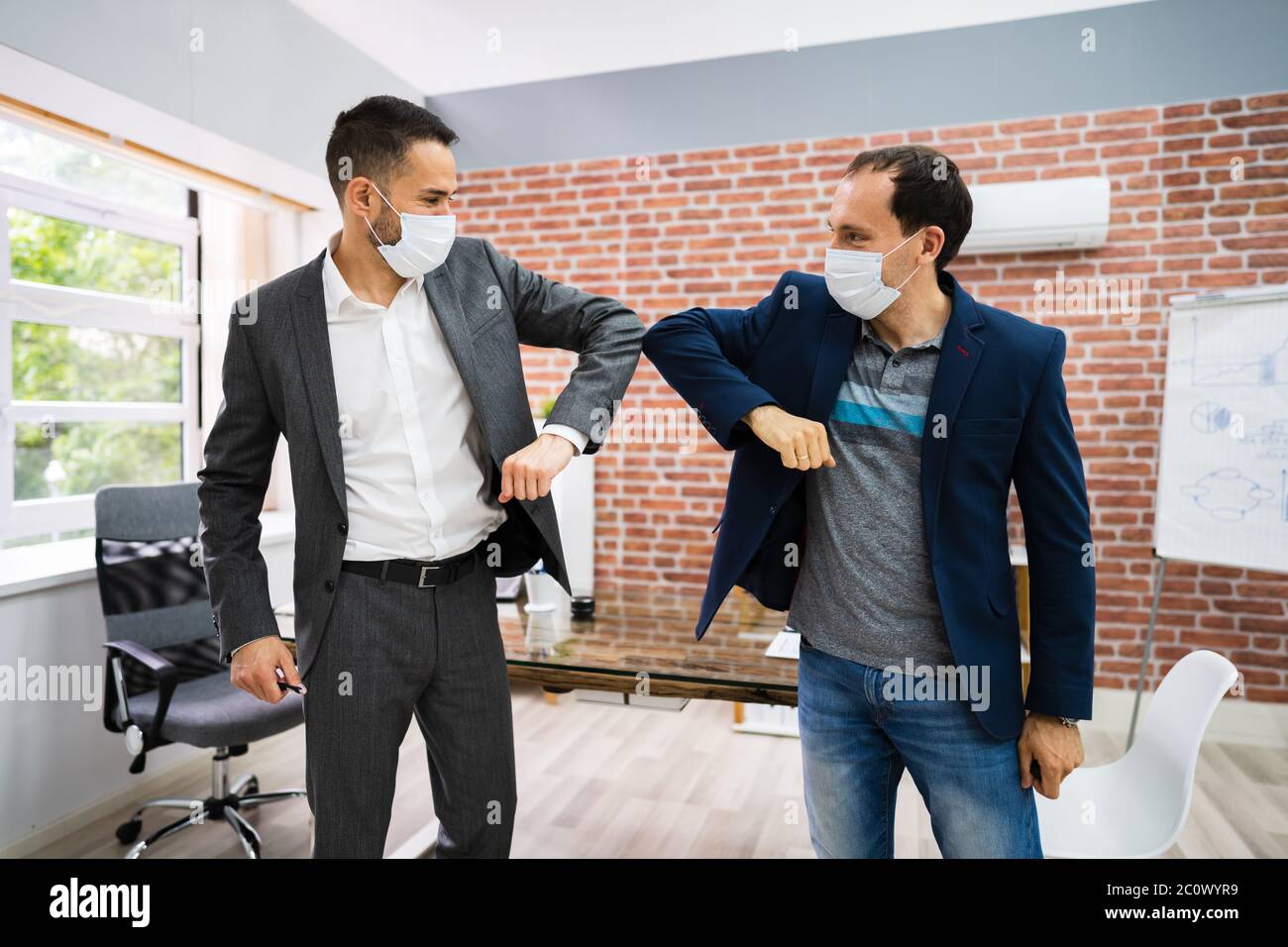 Man Avoiding Handshake To Stop Covid-19 Spread Doing Elbow Bump Stock ...