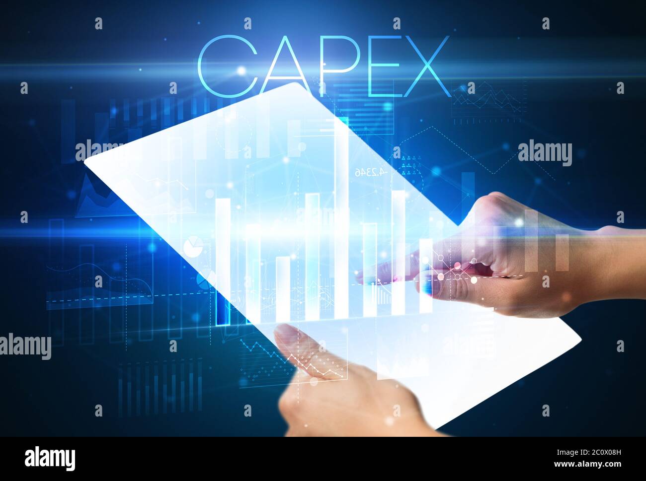 Hand holding futuristic tablet with CAPEX inscription above, modern ...