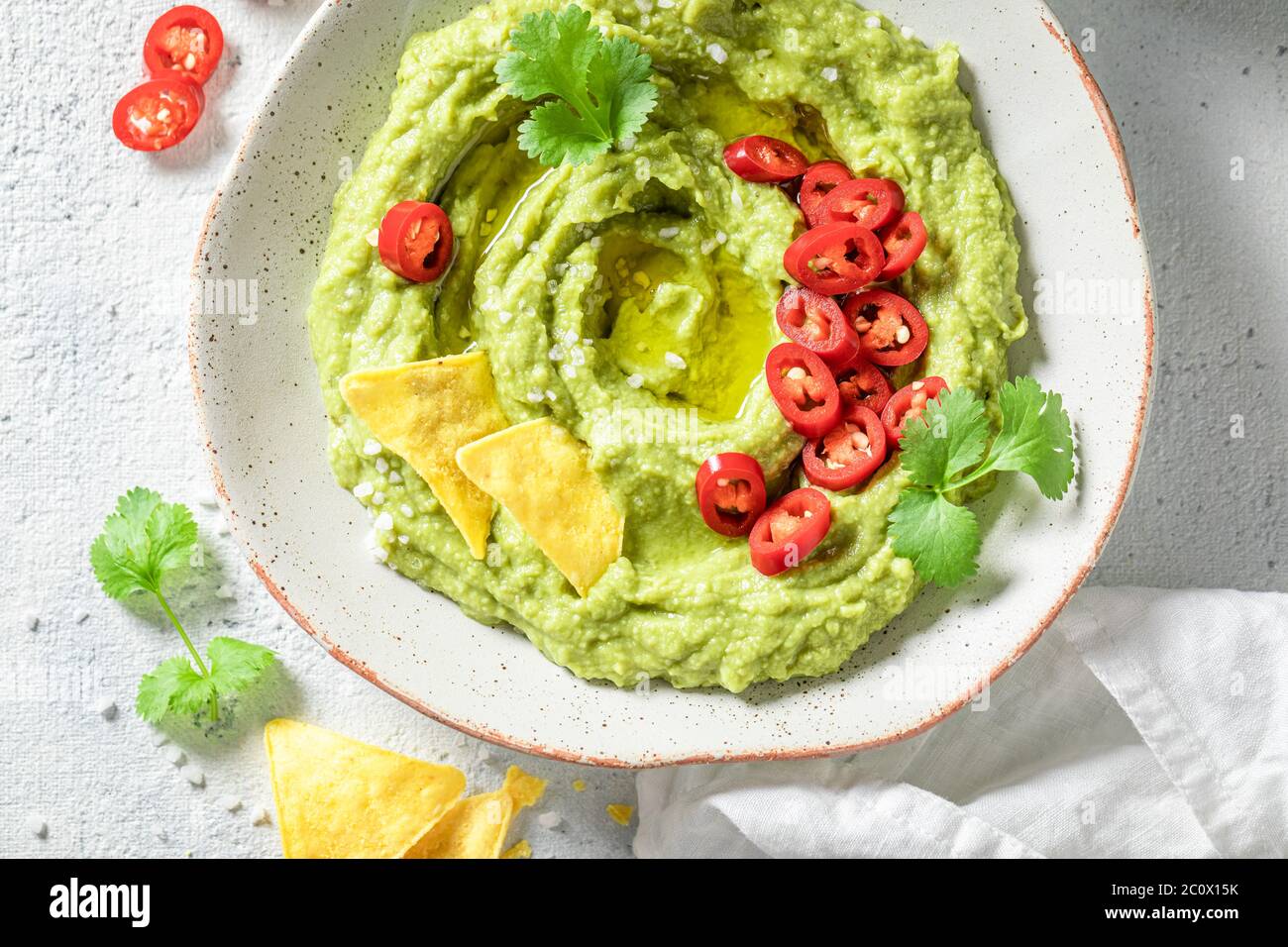 Traditional guacamole as a spicy mexican snack Stock Photo - Alamy
