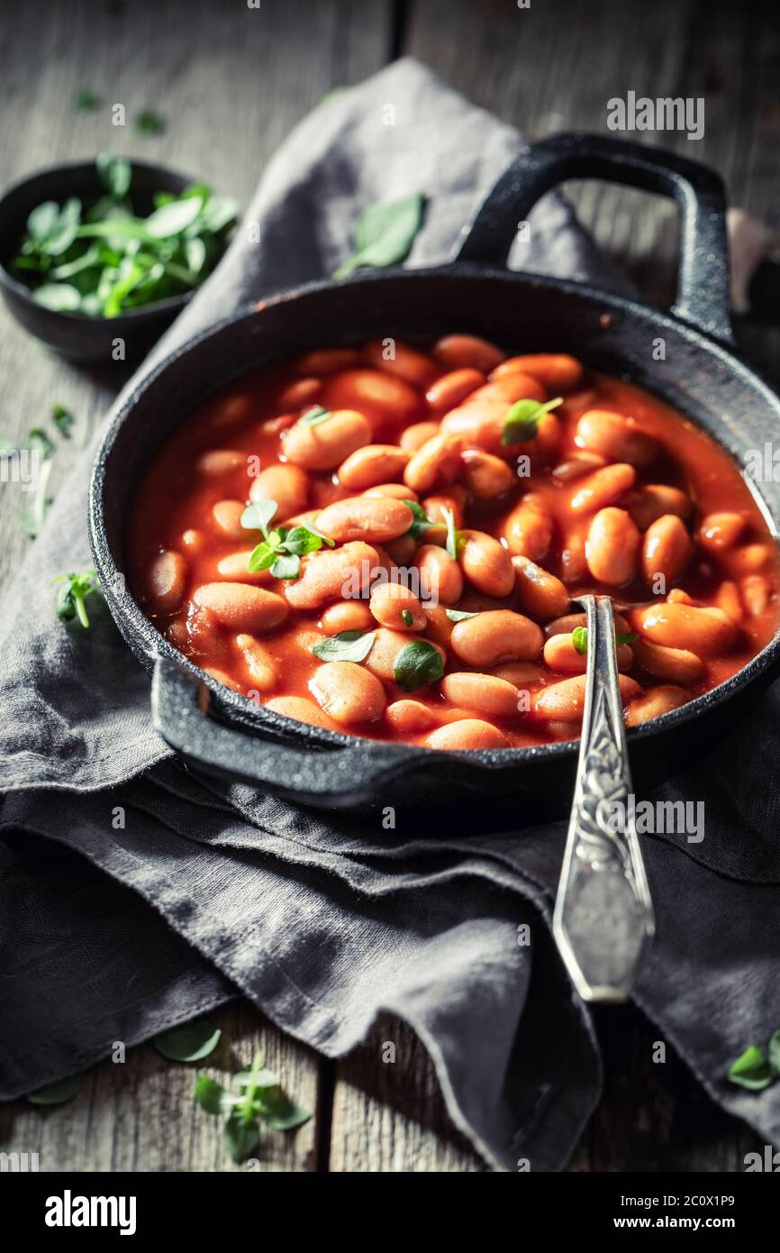 Closeup of baked beans made of fresh tomatoes and herbs Stock Photo - Alamy