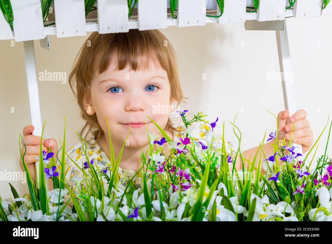 Cute girl with spring flowers Stock Photo - Alamy