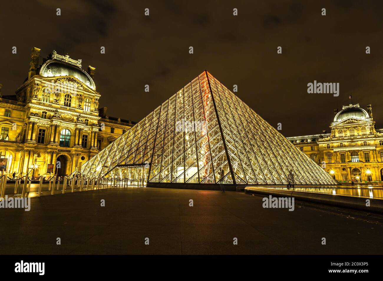 The Louvre at night in Paris Stock Photo - Alamy