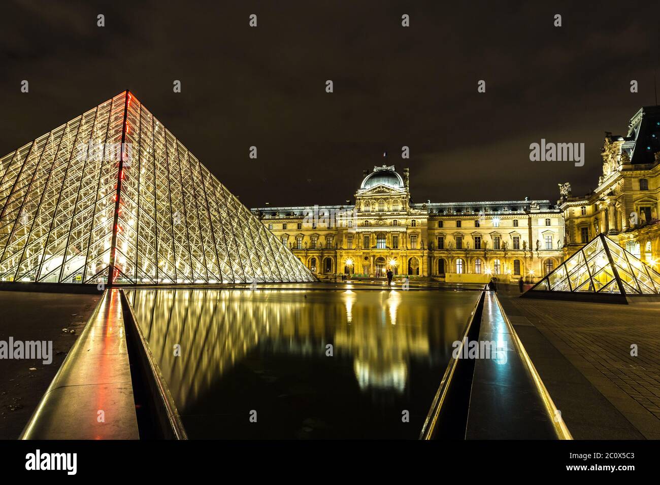 The Louvre at night in Paris Stock Photo - Alamy