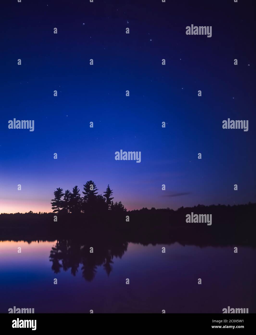 Big Dipper and other stars above Imp Lake in Ottawa National Forest in ...