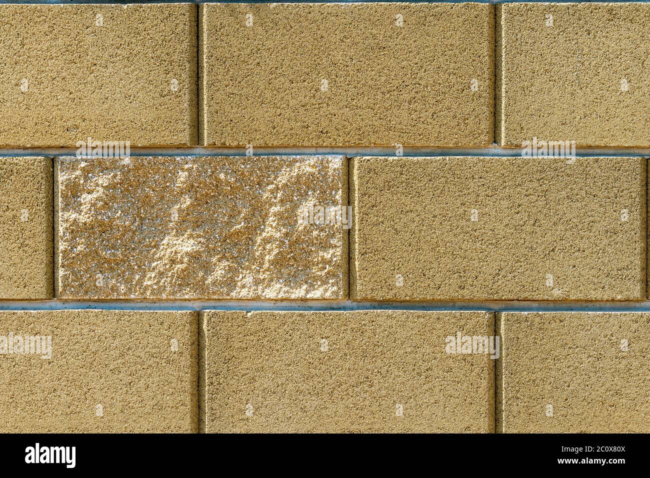 Big yellow concrete brick wall texture background, material of industry ...