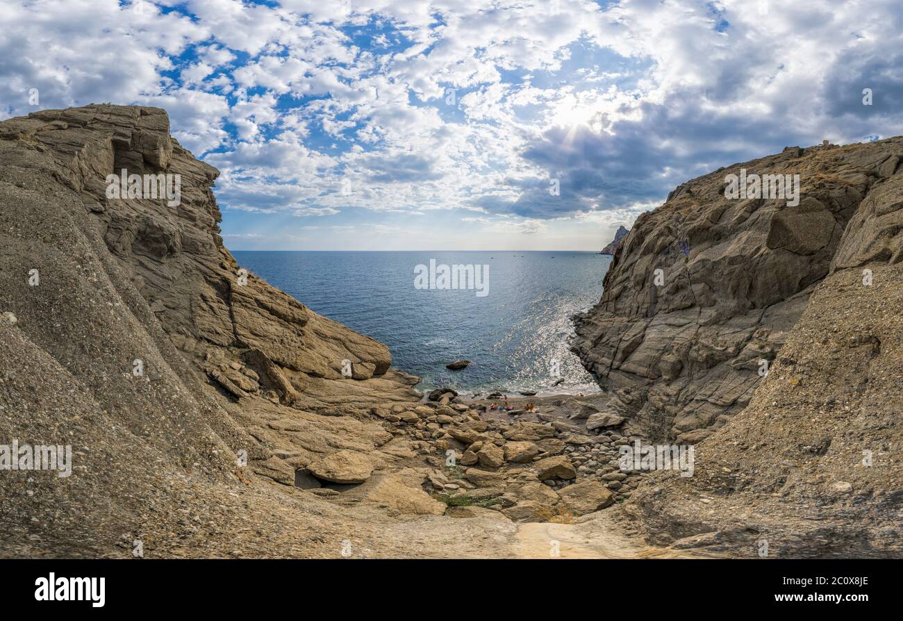 Wild rock beach with natural rock formation. The concept of an active ...