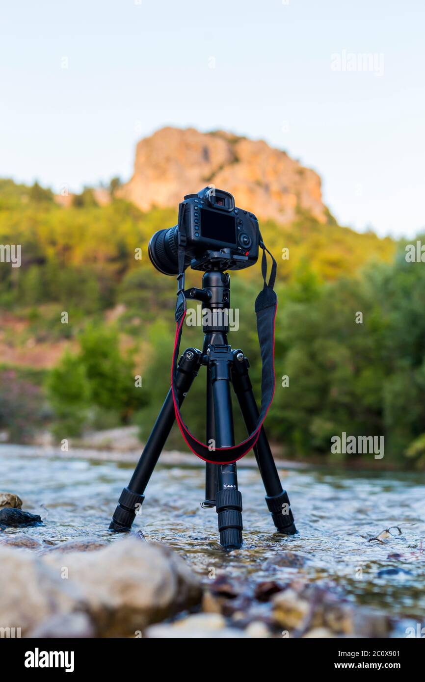 Camera standing in the river Stock Photo - Alamy