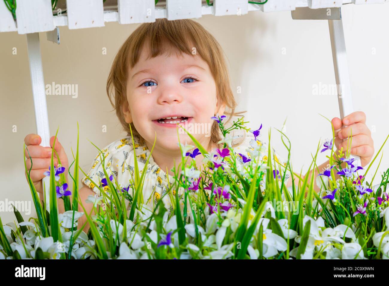 Cute girl with spring flowers Stock Photo - Alamy