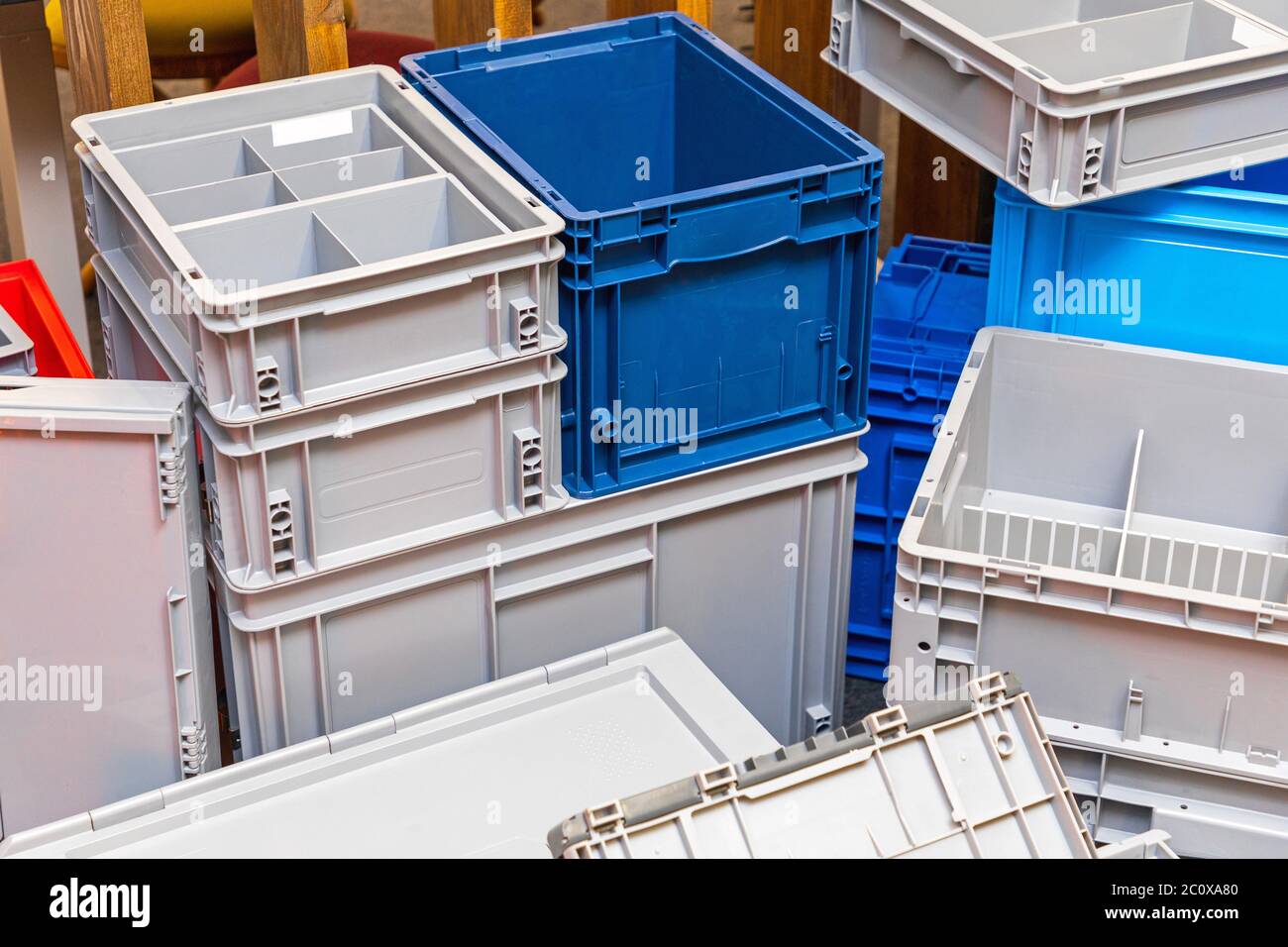 Many Plastic Transport Boxes and Crates Stock Photo - Alamy
