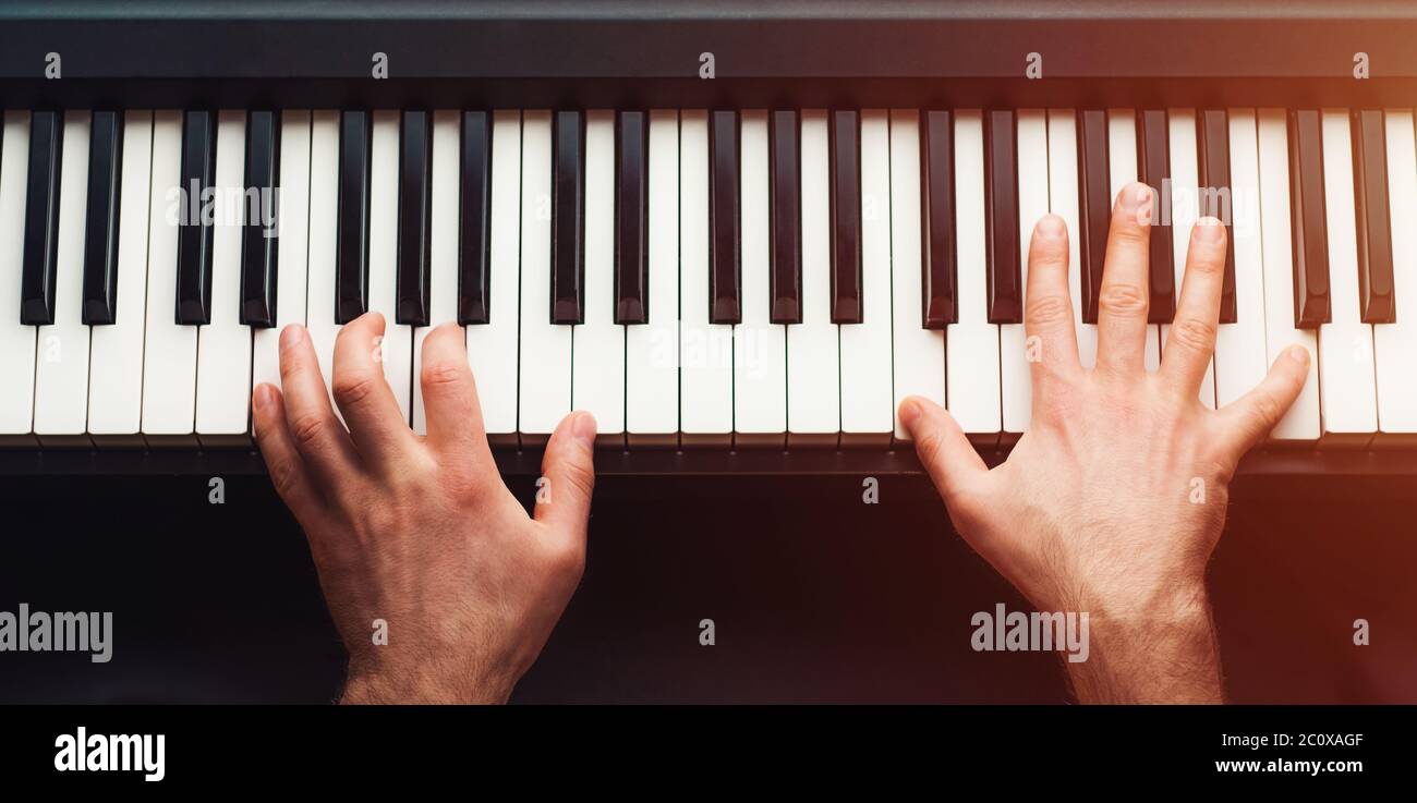 Man playing piano, top view Stock Photo - Alamy