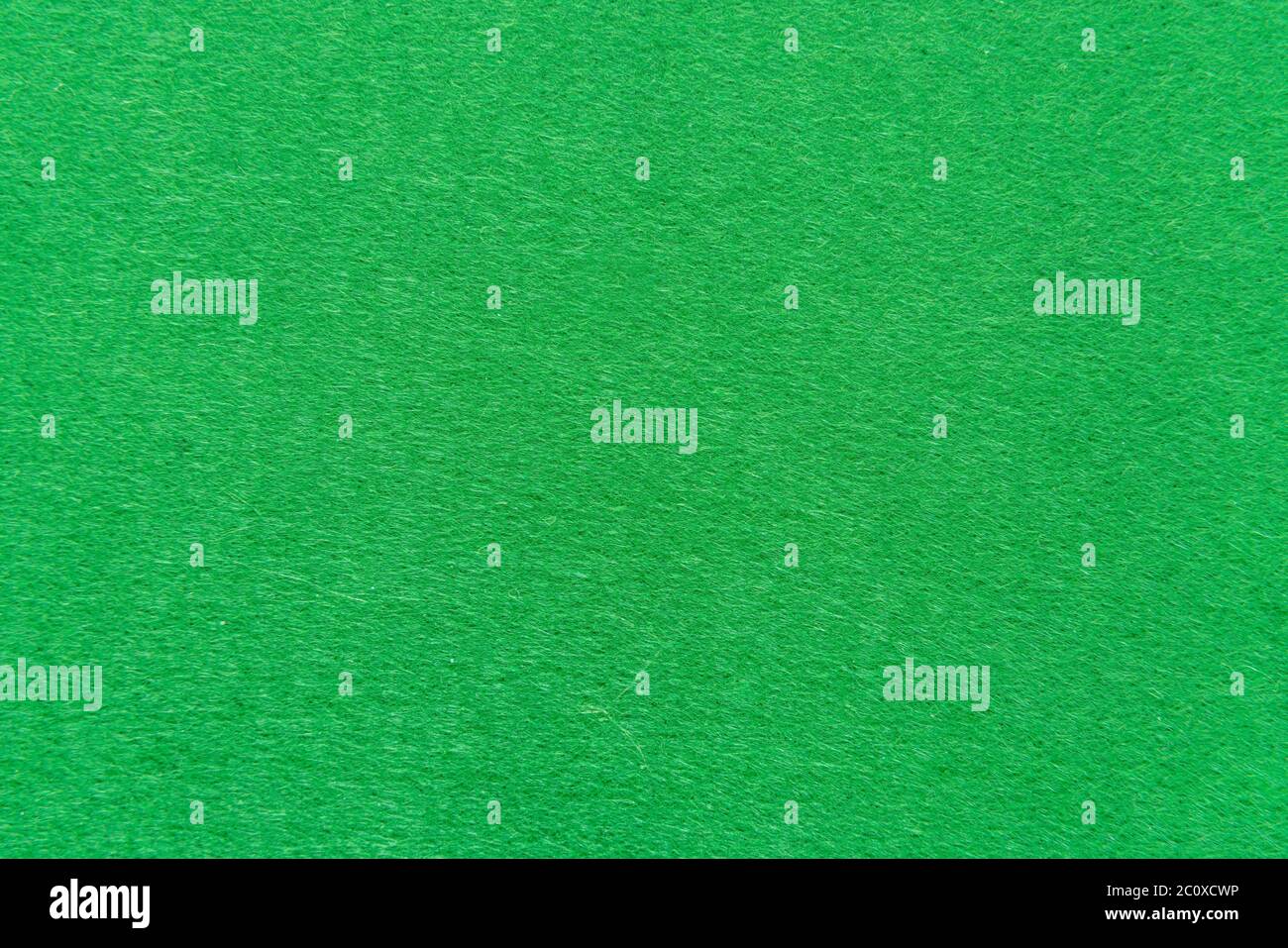 High resolution close up of bright green felt fabric texture of rough ...