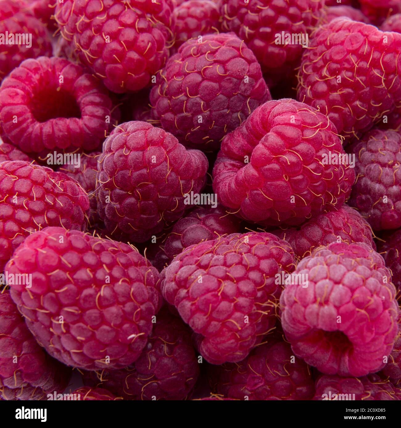 Raspberries background red berry texture pattern Stock Photo - Alamy