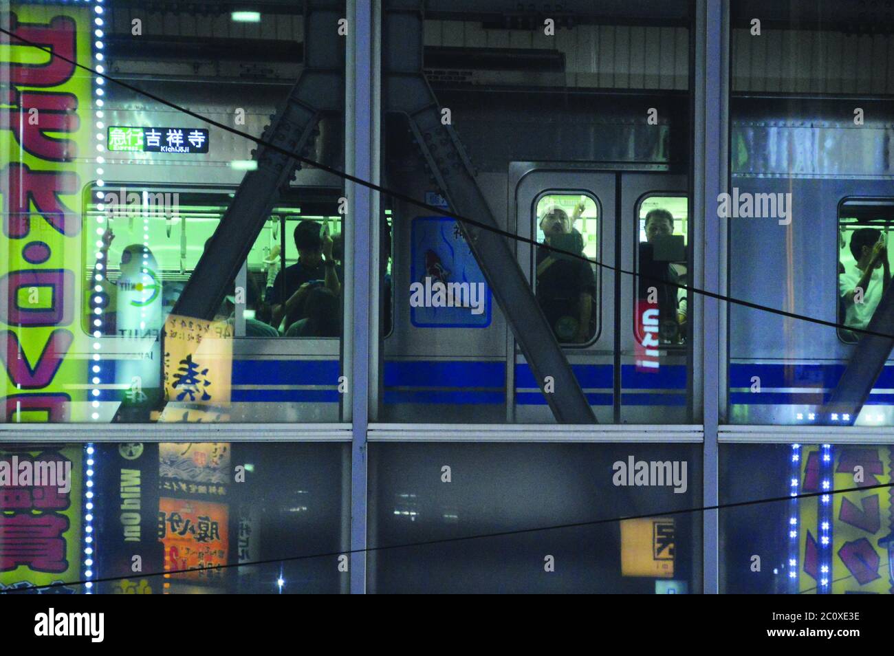 Tokyo metro reflections Stock Photo - Alamy