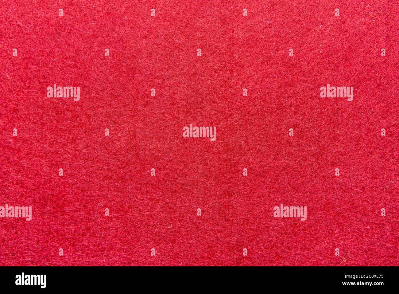 High resolution close up of bright red felt fabric texture of rough ...