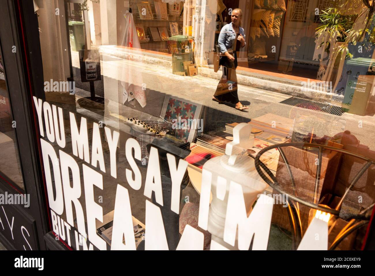 Street scenes trough the shop window of a box rental store. Haji Lane ...