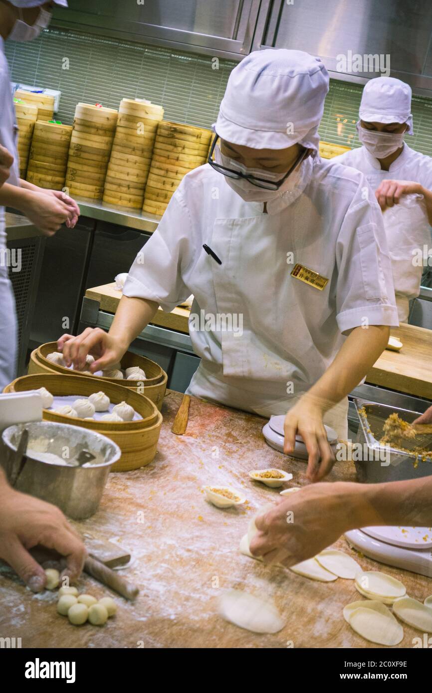 Cookers at works at Din Tai Fung open kitchen. Marina Bay Sands ...
