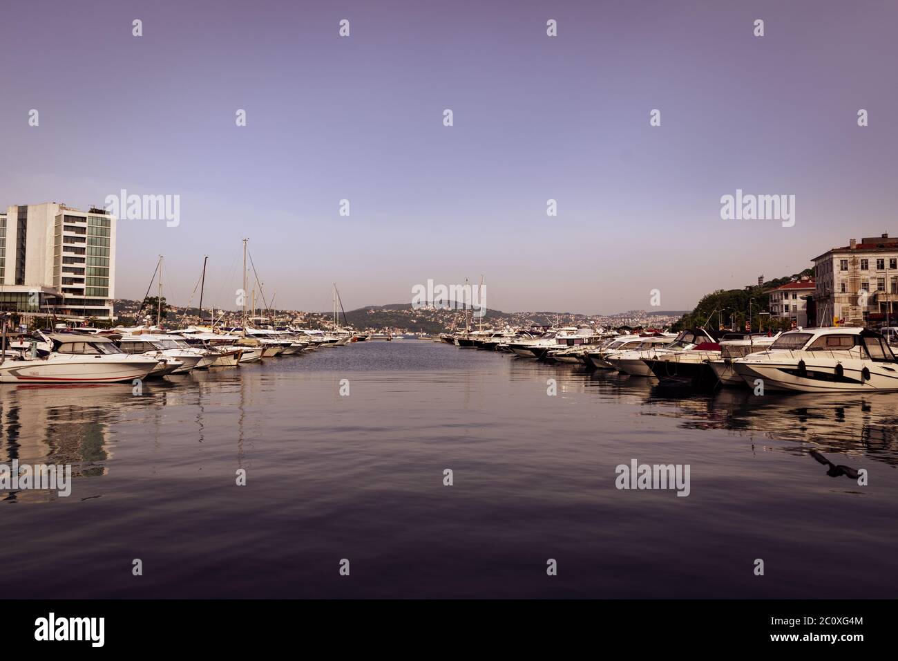 general plan of a marina with yachts and boats, parked. blue sky and ...