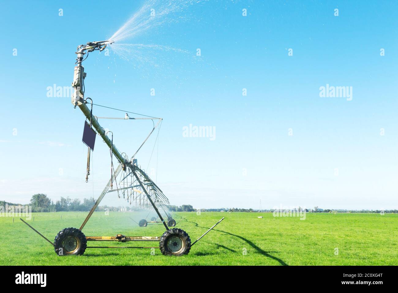 spray water machine in grassland Stock Photo - Alamy