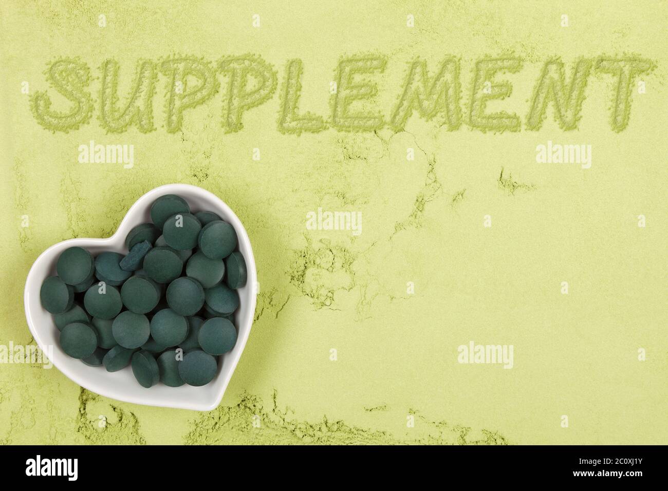 Green food supplement background Stock Photo - Alamy