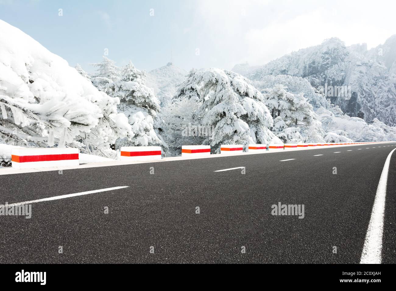 asphalt road with snow scene on Huangshan Mountain Stock Photo - Alamy