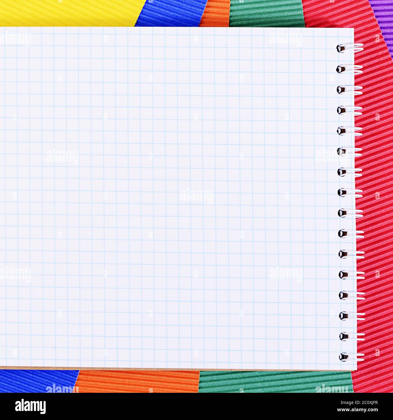 Writing-book in cage on color paper Stock Photo - Alamy