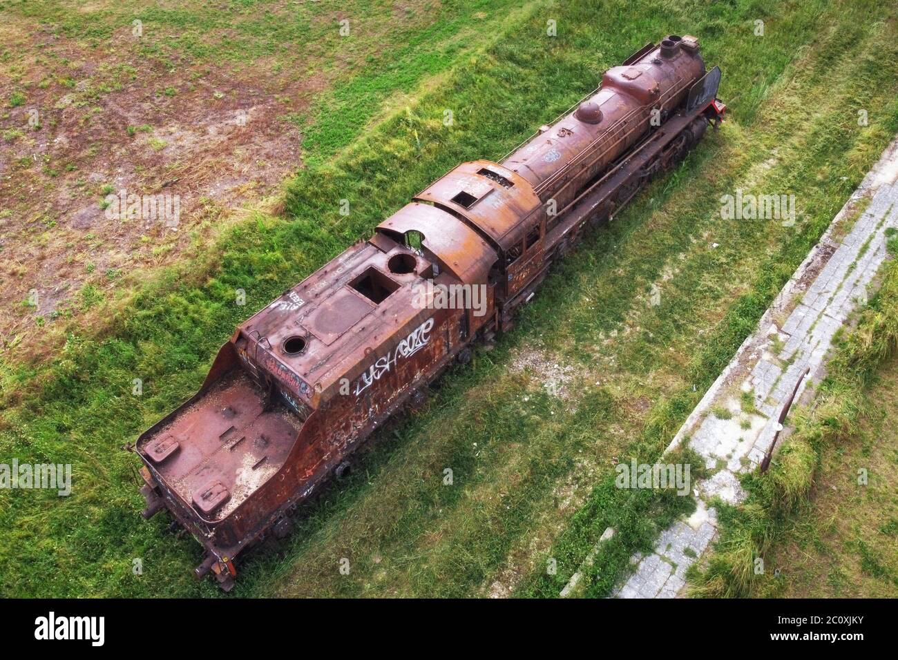 Old train cemetery. Aerial view of an old abandoned rusty steam train ...