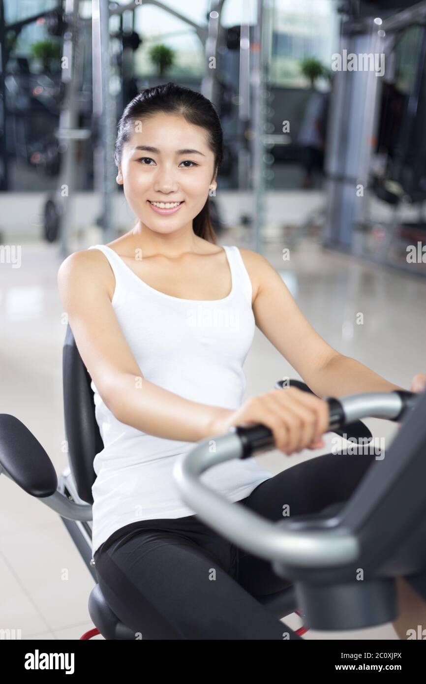 beautiful girl working out in modern gym Stock Photo - Alamy