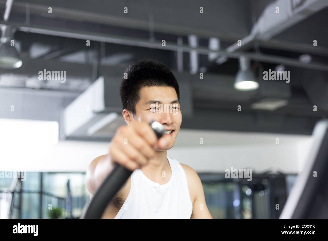 young man working out in modern gym Stock Photo - Alamy