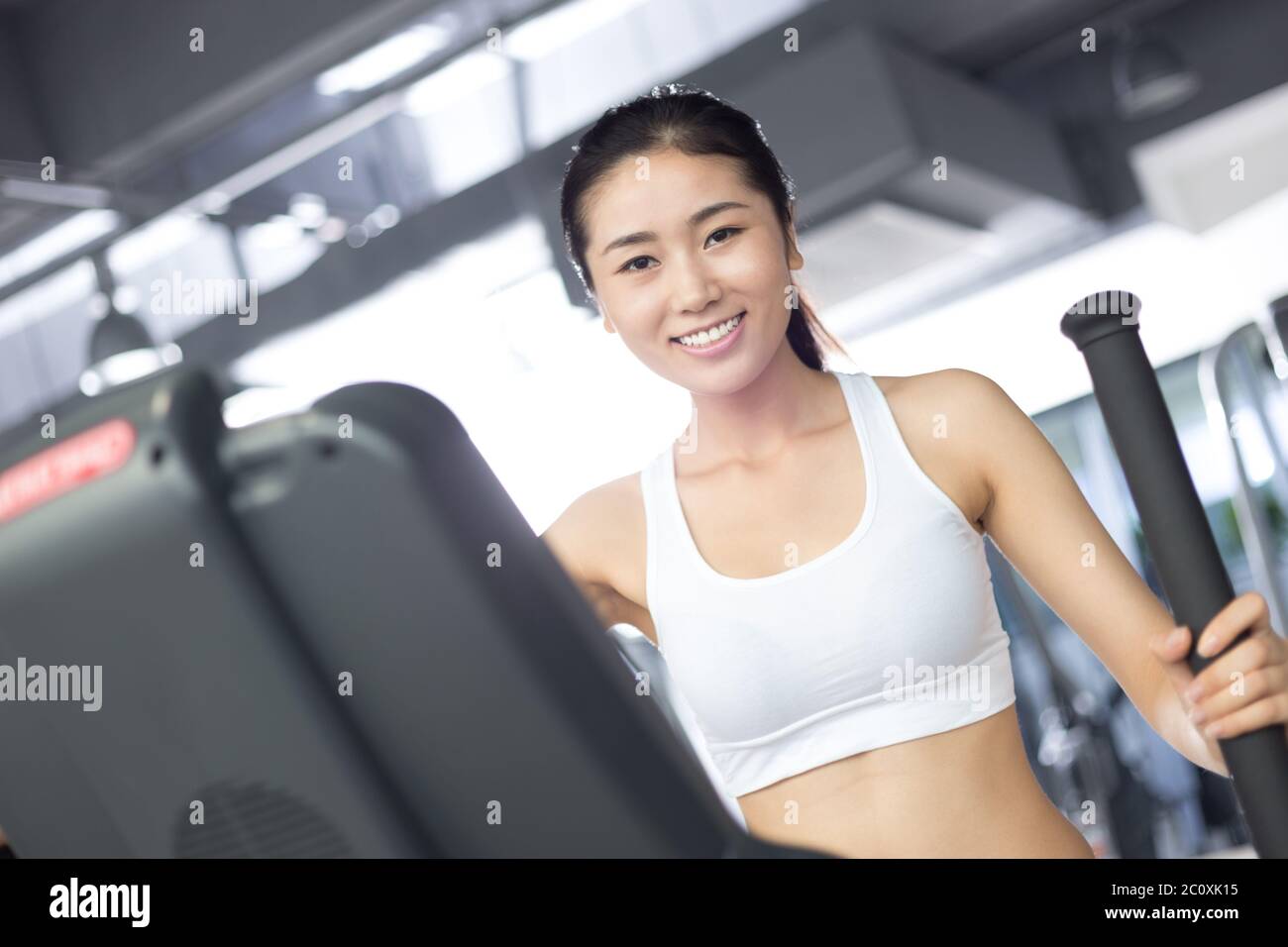 beautiful girl working out in modern gym Stock Photo - Alamy