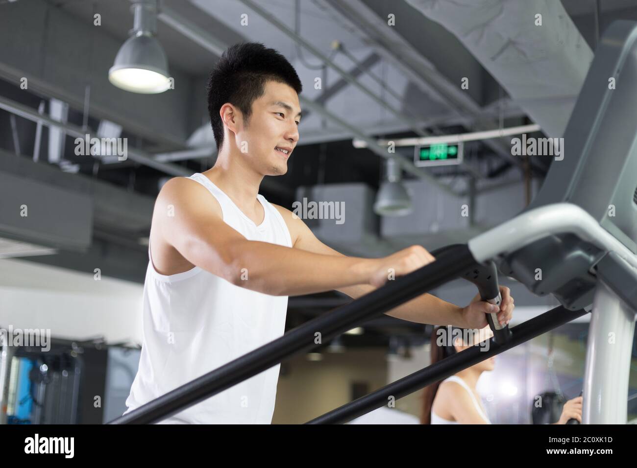 young man working out in modern gym Stock Photo - Alamy