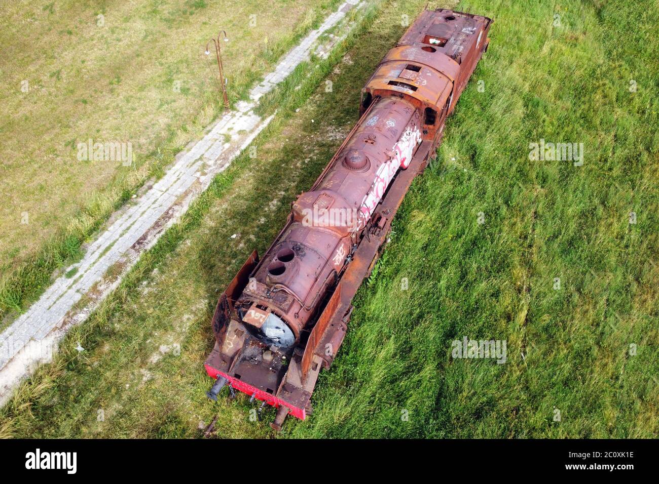 Old train cemetery. Aerial view of an old abandoned rusty steam train ...