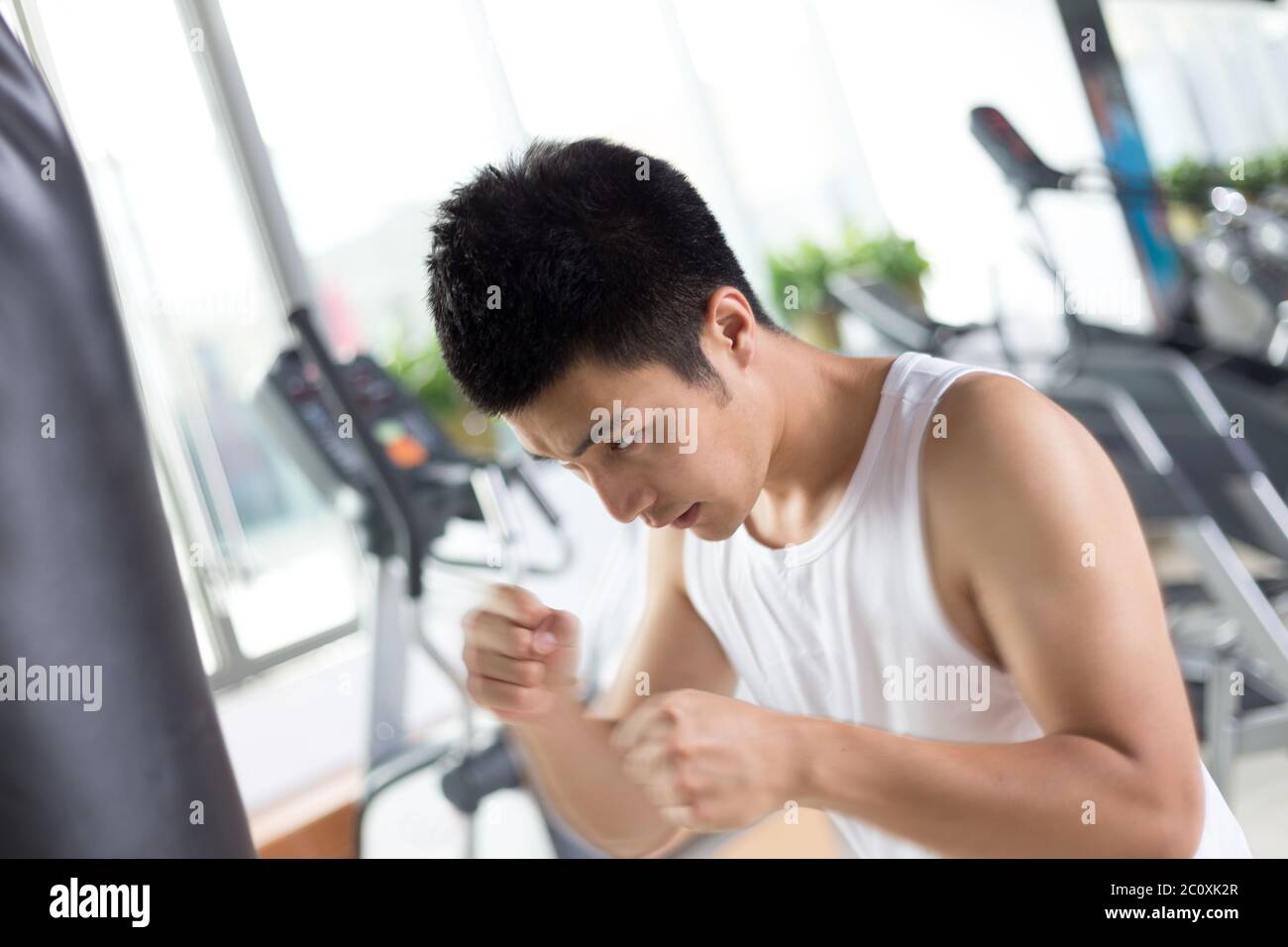 young man working out in modern gym Stock Photo - Alamy