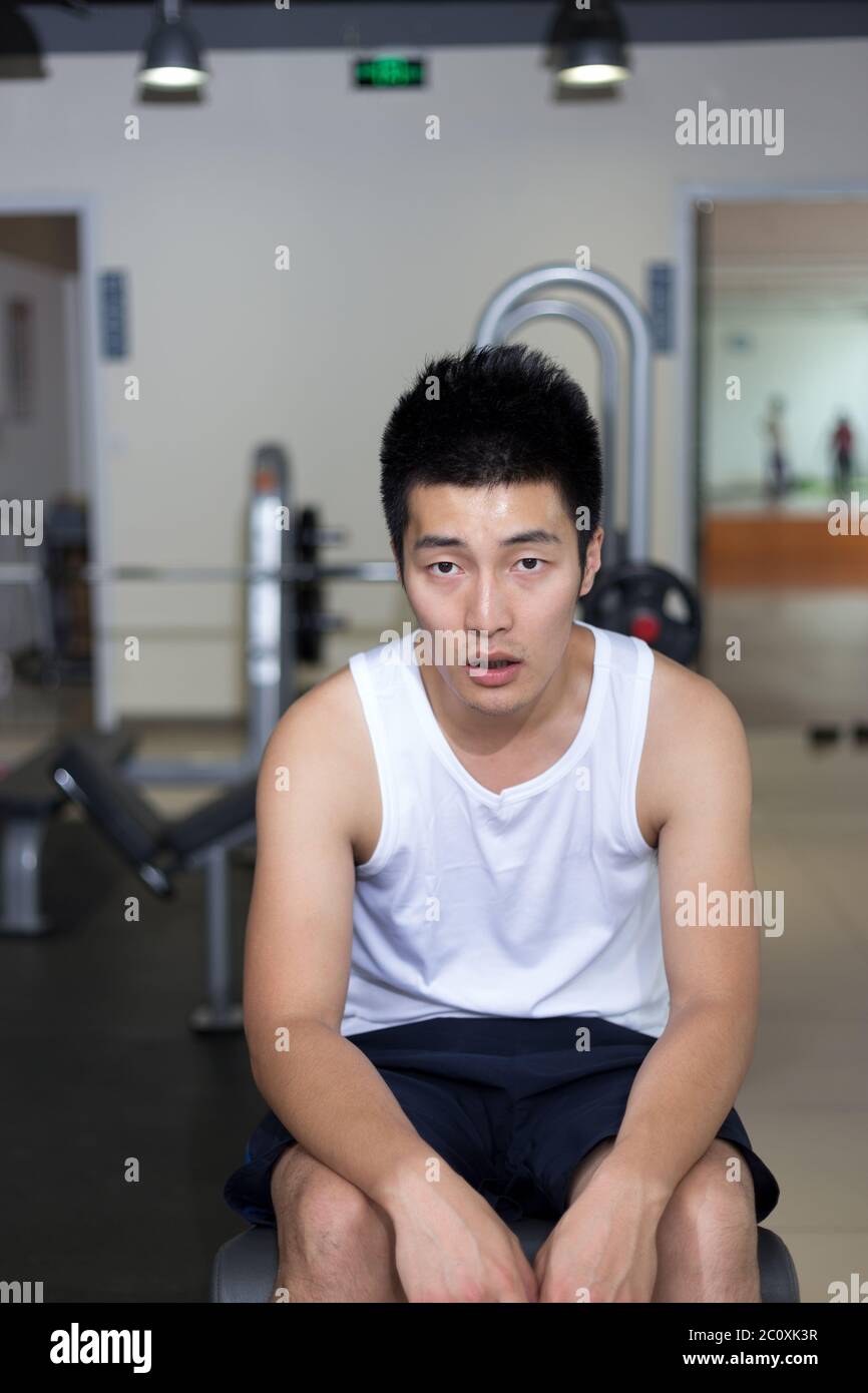 young man working out in modern gym Stock Photo - Alamy