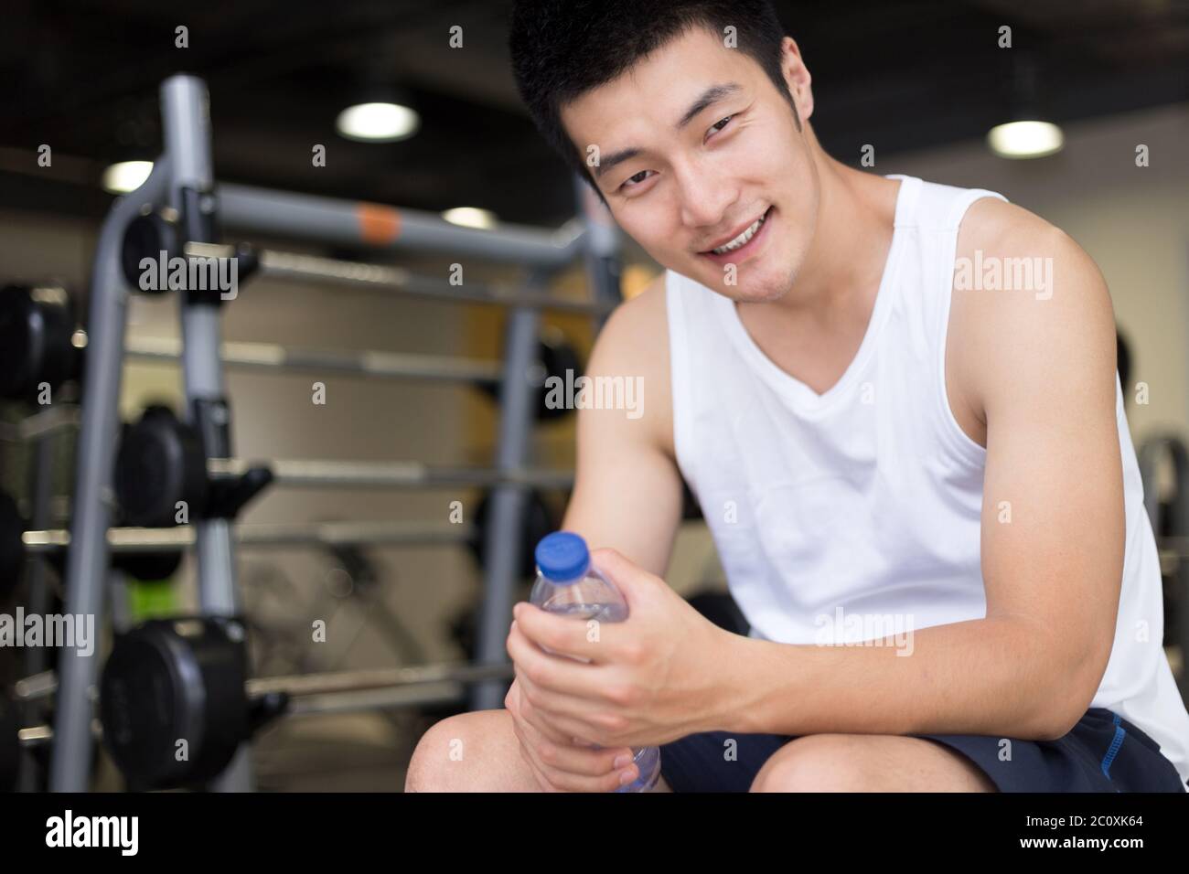 young man working out in modern gym Stock Photo - Alamy