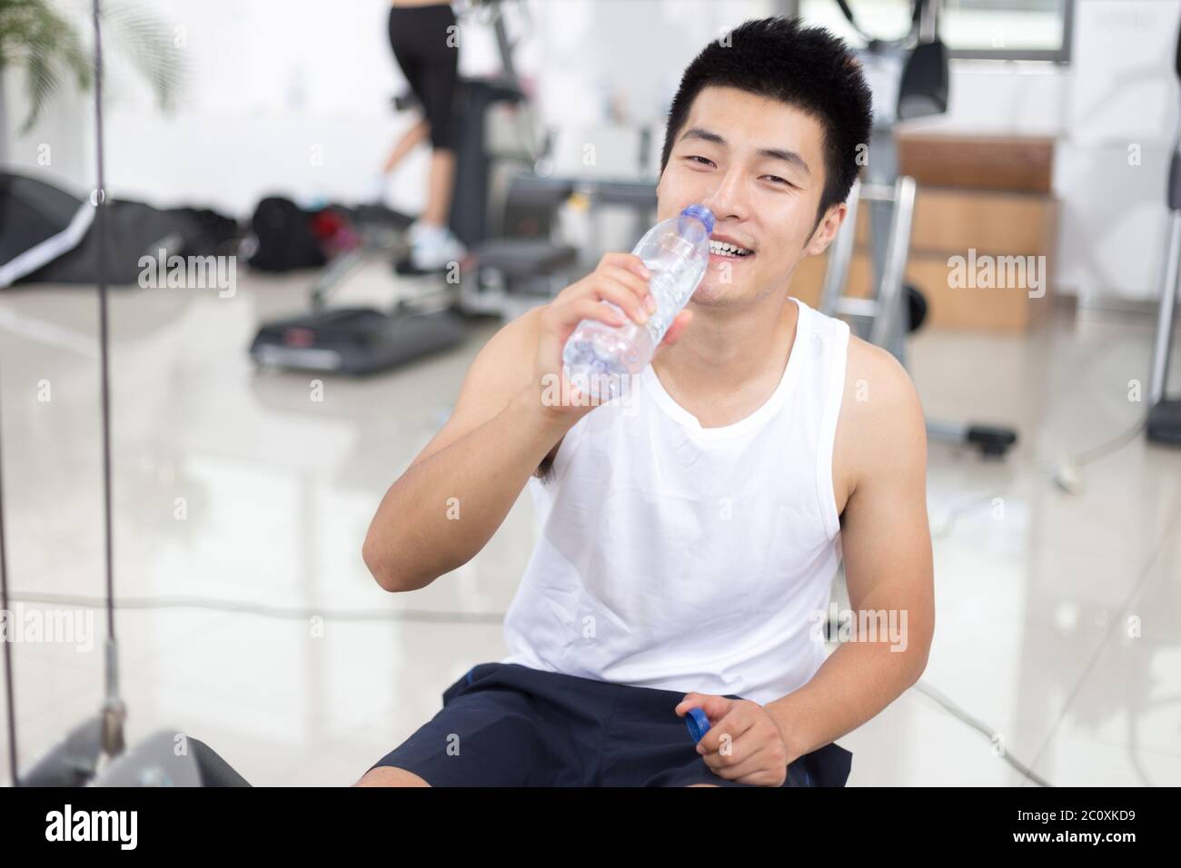 young man working out in modern gym Stock Photo - Alamy