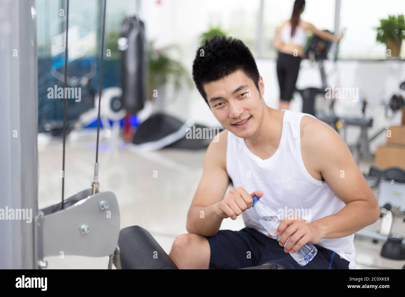 young man working out in modern gym Stock Photo - Alamy