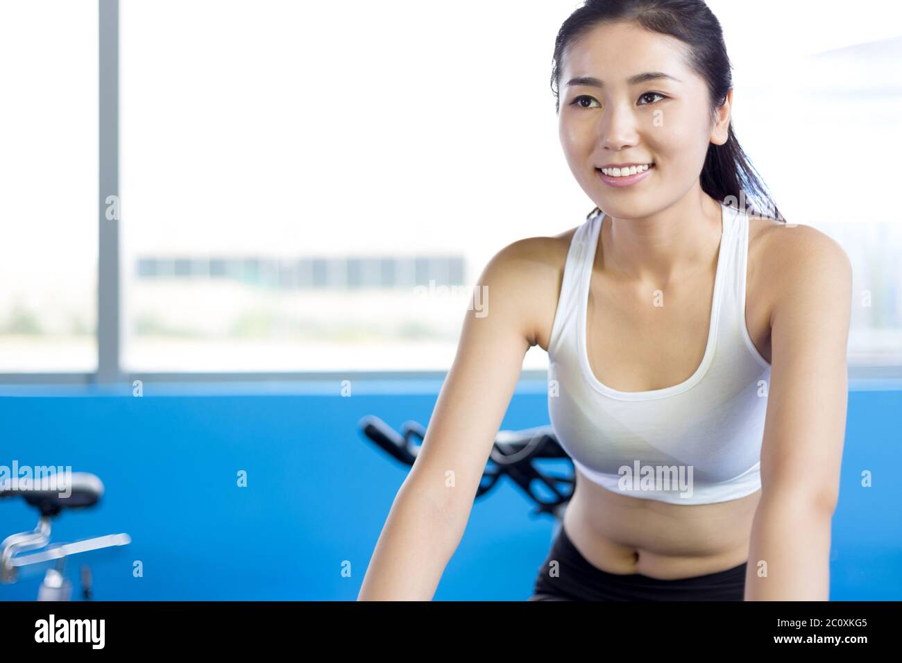 beautiful girl working out in modern gym Stock Photo - Alamy