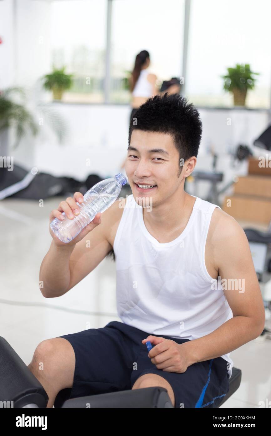 young man working out in modern gym Stock Photo - Alamy