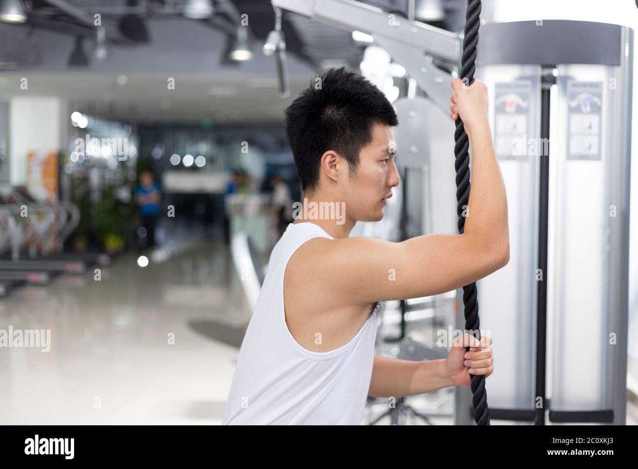 young man working out in modern gym Stock Photo - Alamy