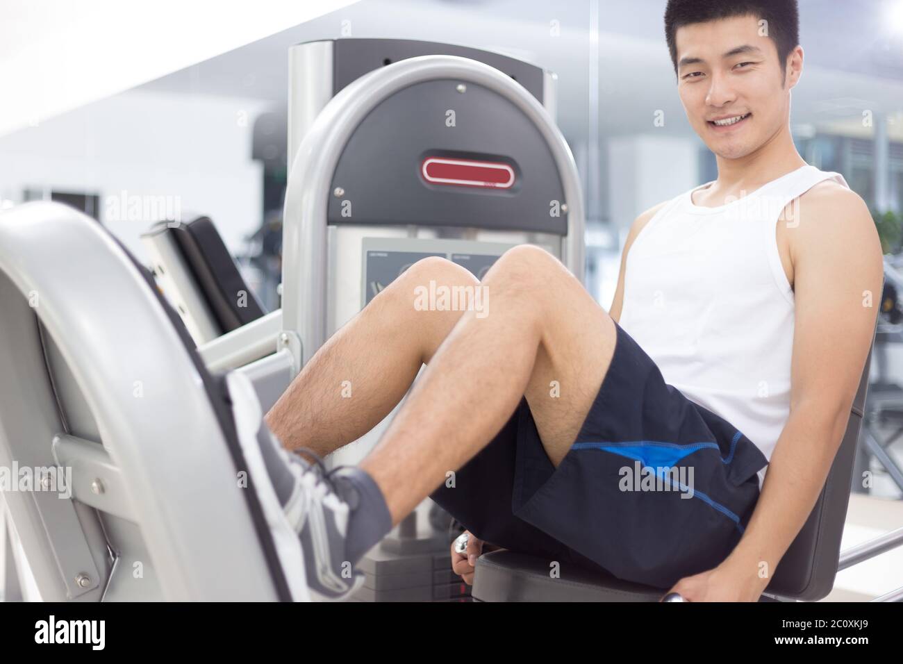 young man working out in modern gym Stock Photo - Alamy