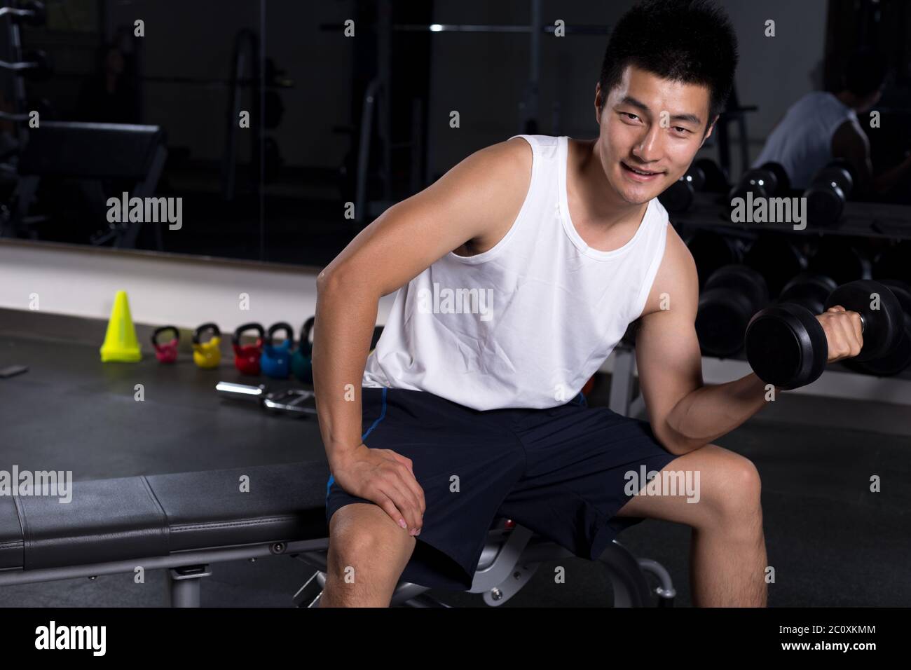 young man working out in modern gym Stock Photo - Alamy