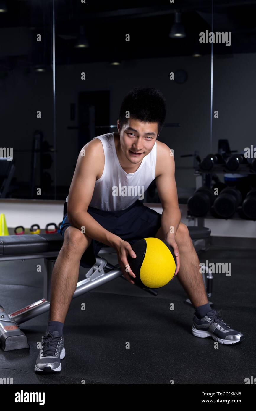 young man working out in modern gym Stock Photo - Alamy